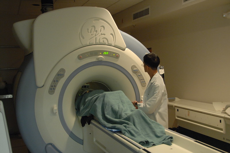person in MRI tube - ClearHealthCosts